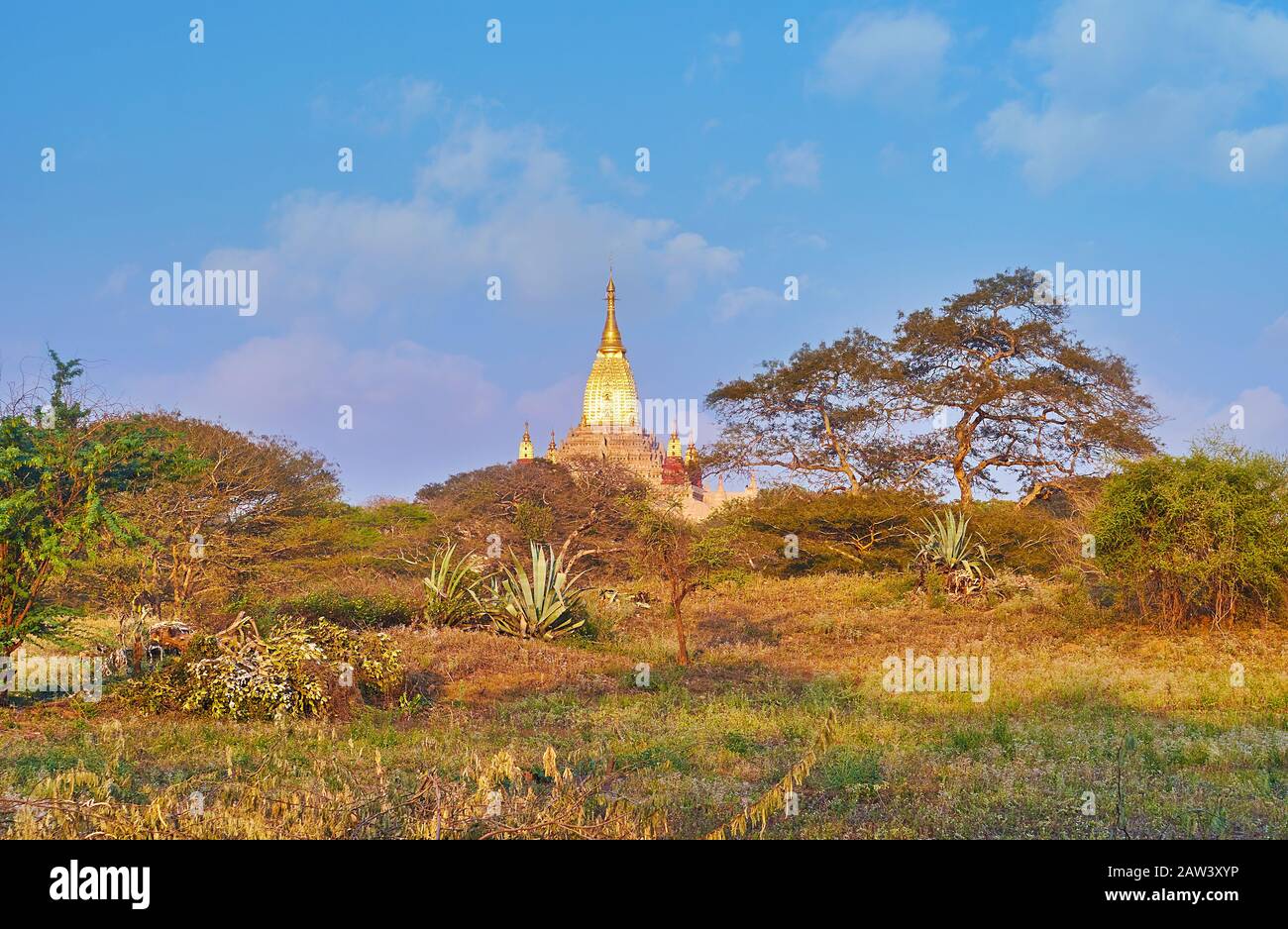 The gilt sikhara tower of Ananda Phaya, topped with hti umbrella, is ...