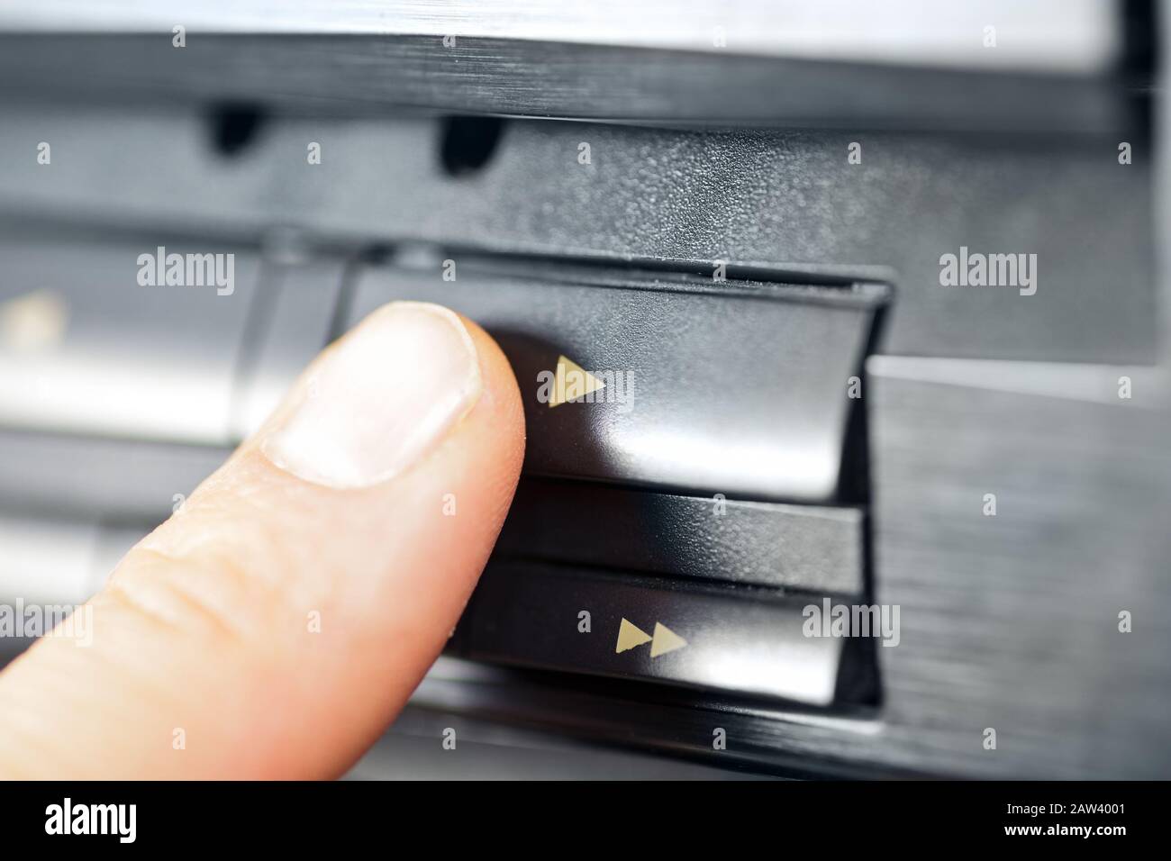 Finger pushing play button on a vintage audio cassette deck Stock Photo ...