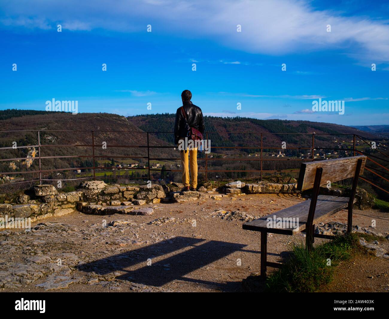 A Solo Traveler Looking Out Over The Hill Country Of Southern France ...