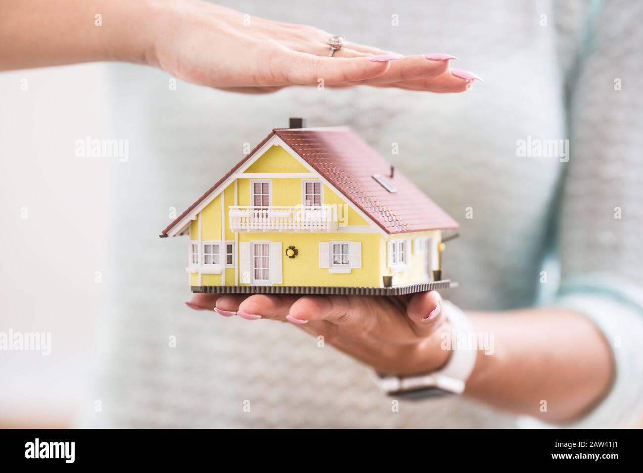 Property hands house toy hi-res stock photography and images - Alamy