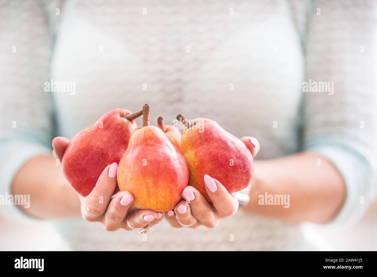 Woman with pears hi-res stock photography and images - Alamy
