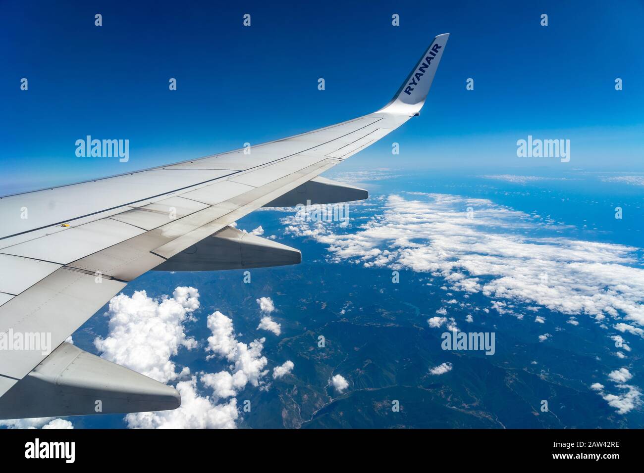 Ryanair flying and traveling, view from airplane window on the wing ...