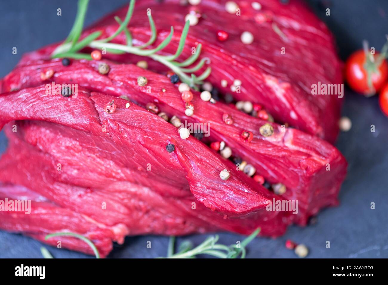 piece of beef cut into steaks Stock Photo - Alamy