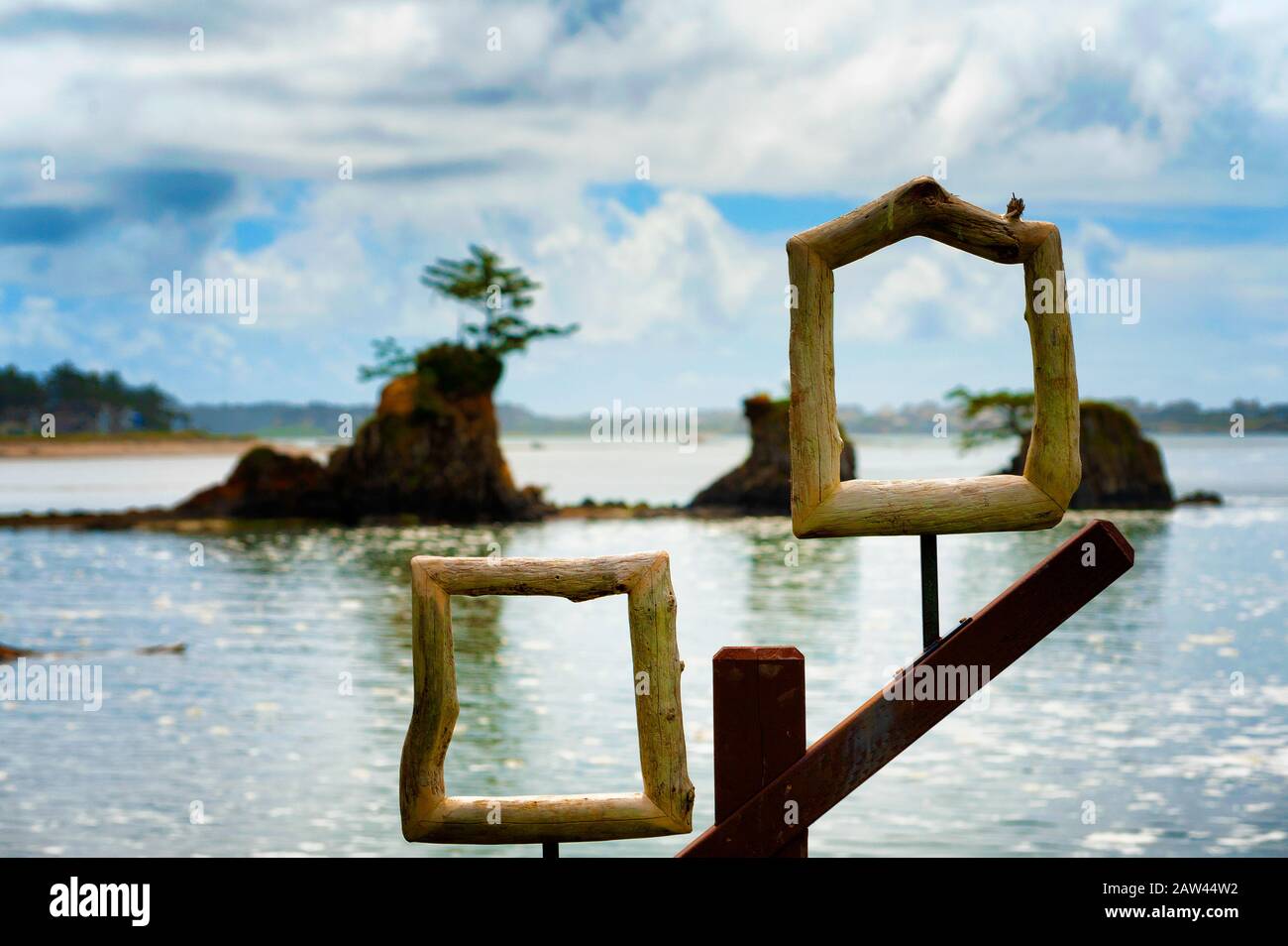 Two wooden picture frames mounted to a post for people to take pictures ...