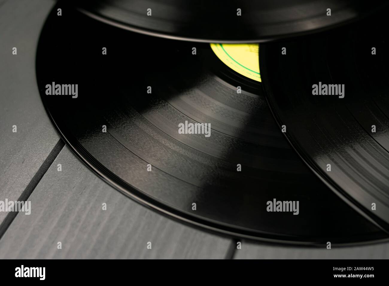 Three traditional glossy black vinyl records without scratches on a ...