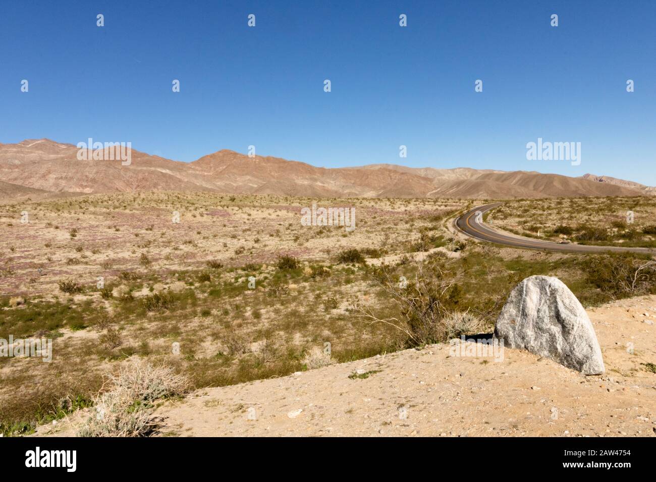 Stark dry southern California desert view with blue sky, lonely empty ...