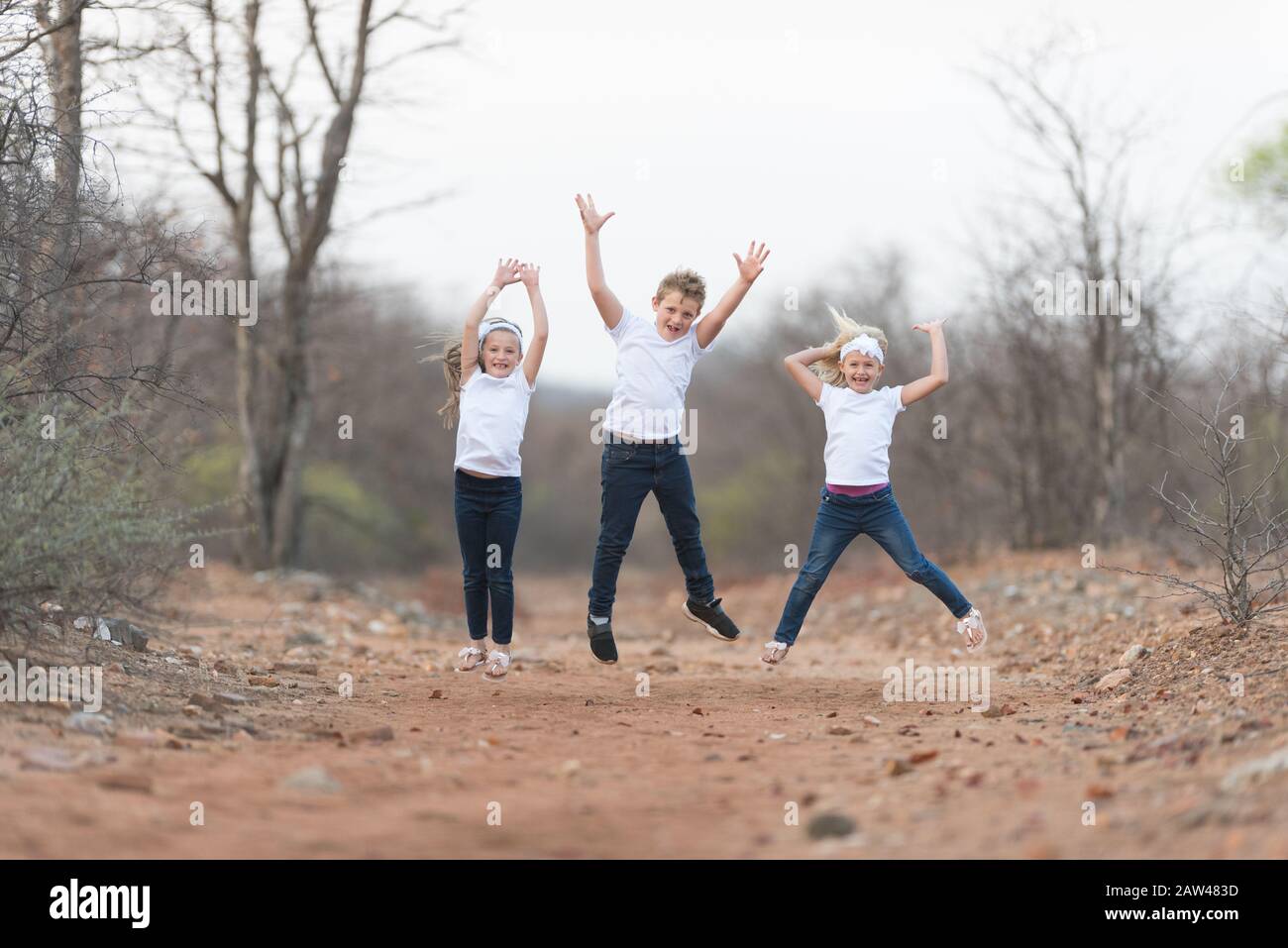 Kids jumping for joy Stock Photo - Alamy