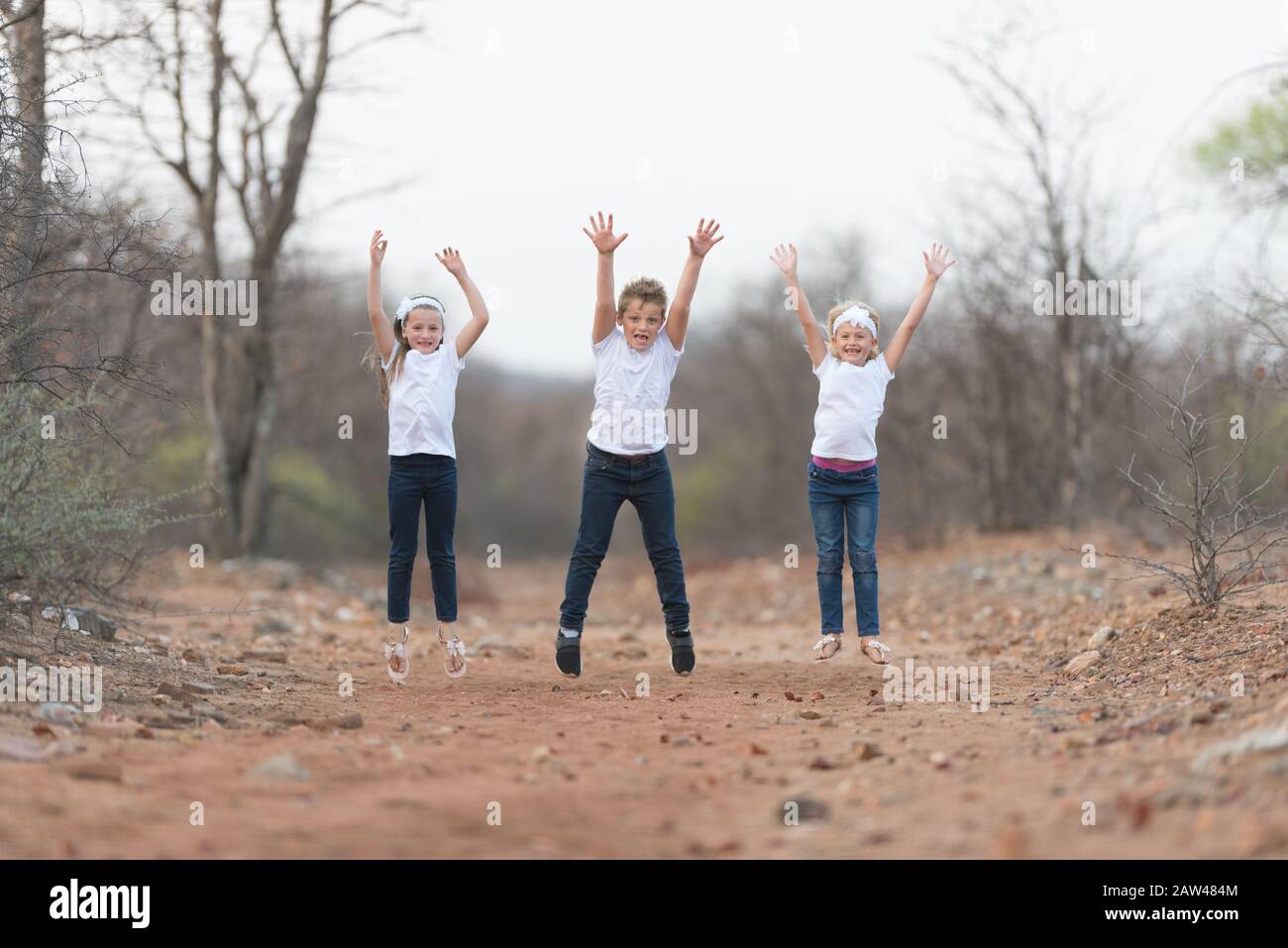 Kids jumping for joy Stock Photo - Alamy