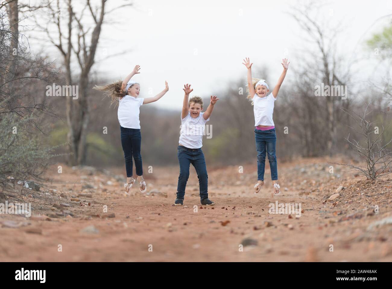 Kids jumping for joy Stock Photo - Alamy