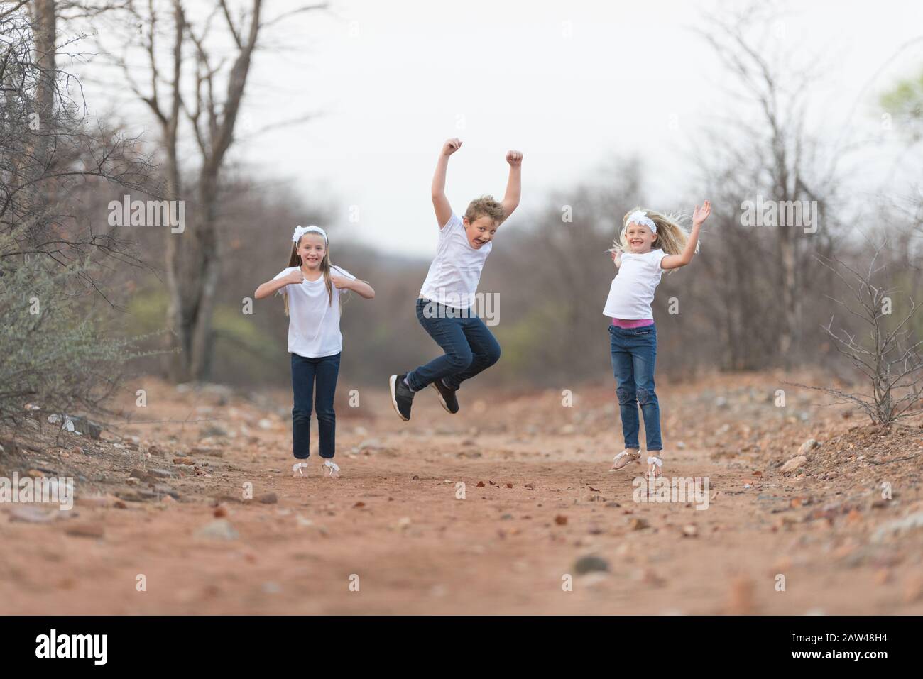 Kids jumping for joy Stock Photo - Alamy
