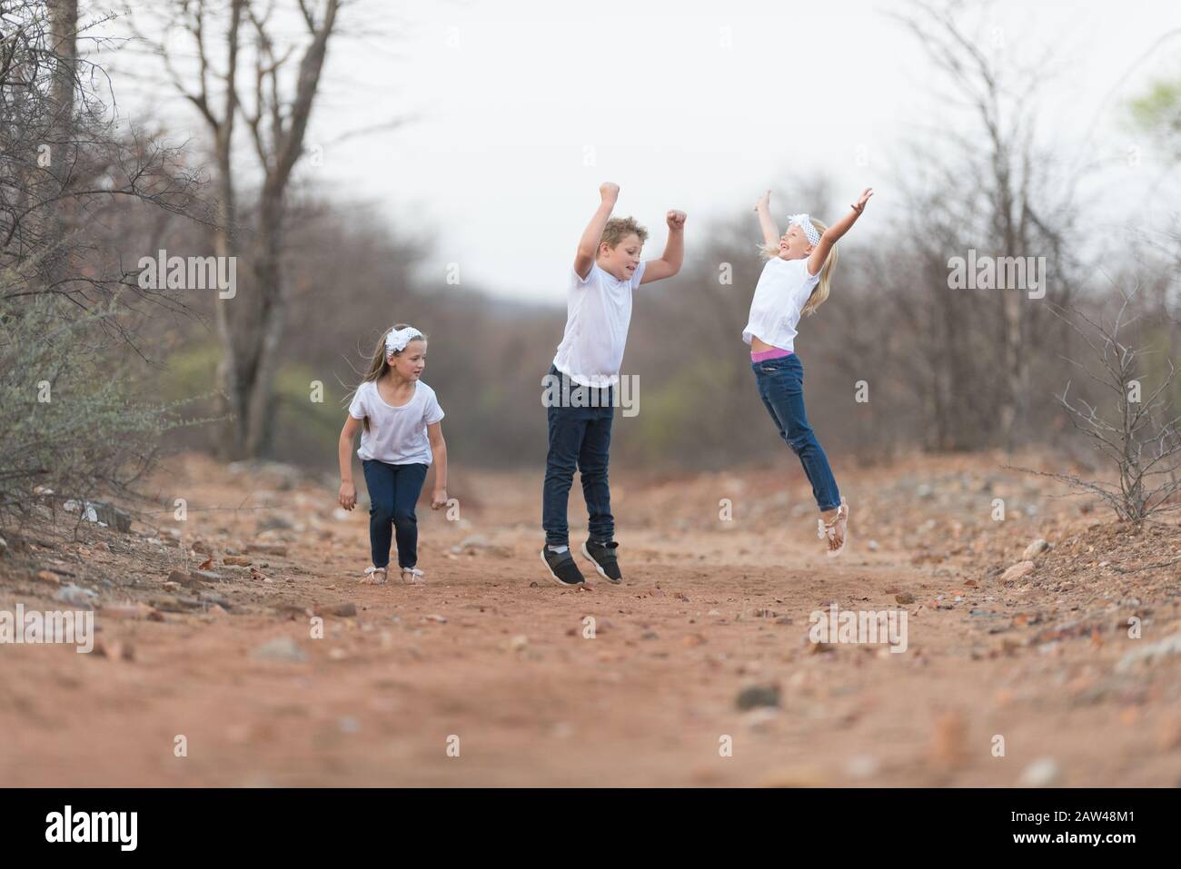 Kids jumping for joy Stock Photo - Alamy