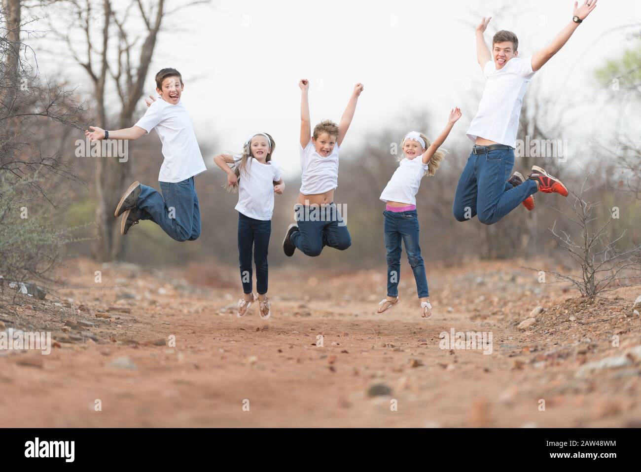 Kids jumping for joy Stock Photo - Alamy