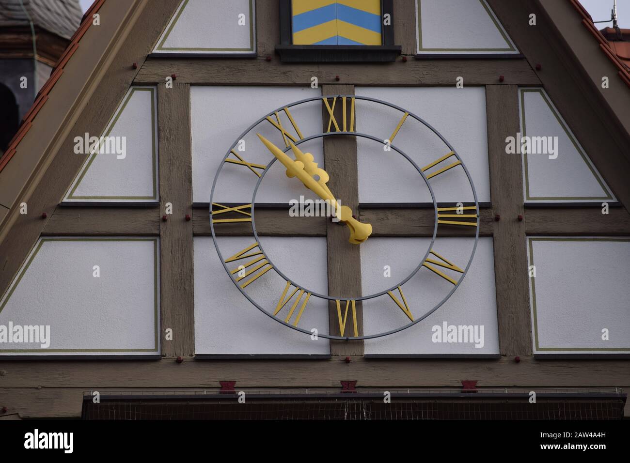 Clock on a historic House gable Stock Photo - Alamy