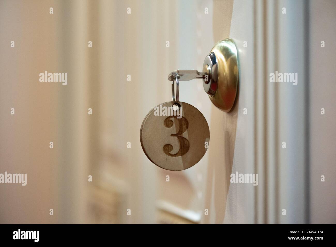 Key in door keyhole close up background Stock Photo - Alamy