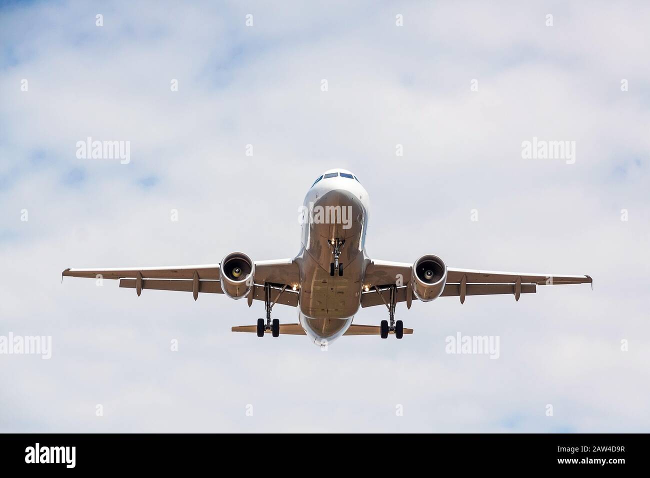 Large commercial airplane flying overhead either after departure or ...