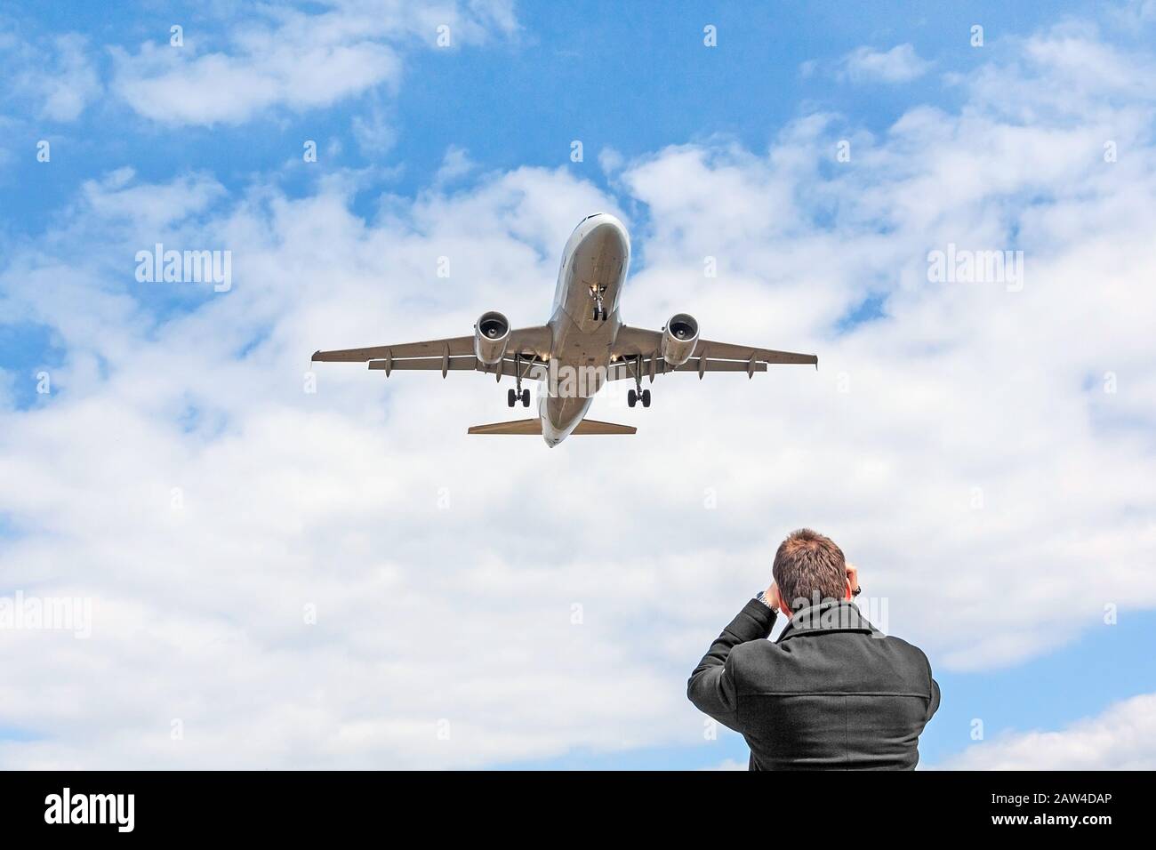 Man looking at photo airport hi-res stock photography and images - Alamy