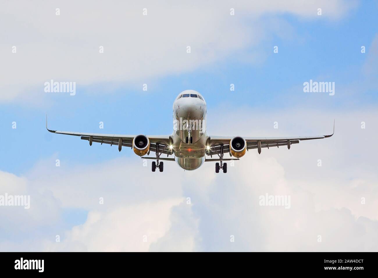 Large commercial airplane flying overhead either after departure or ...