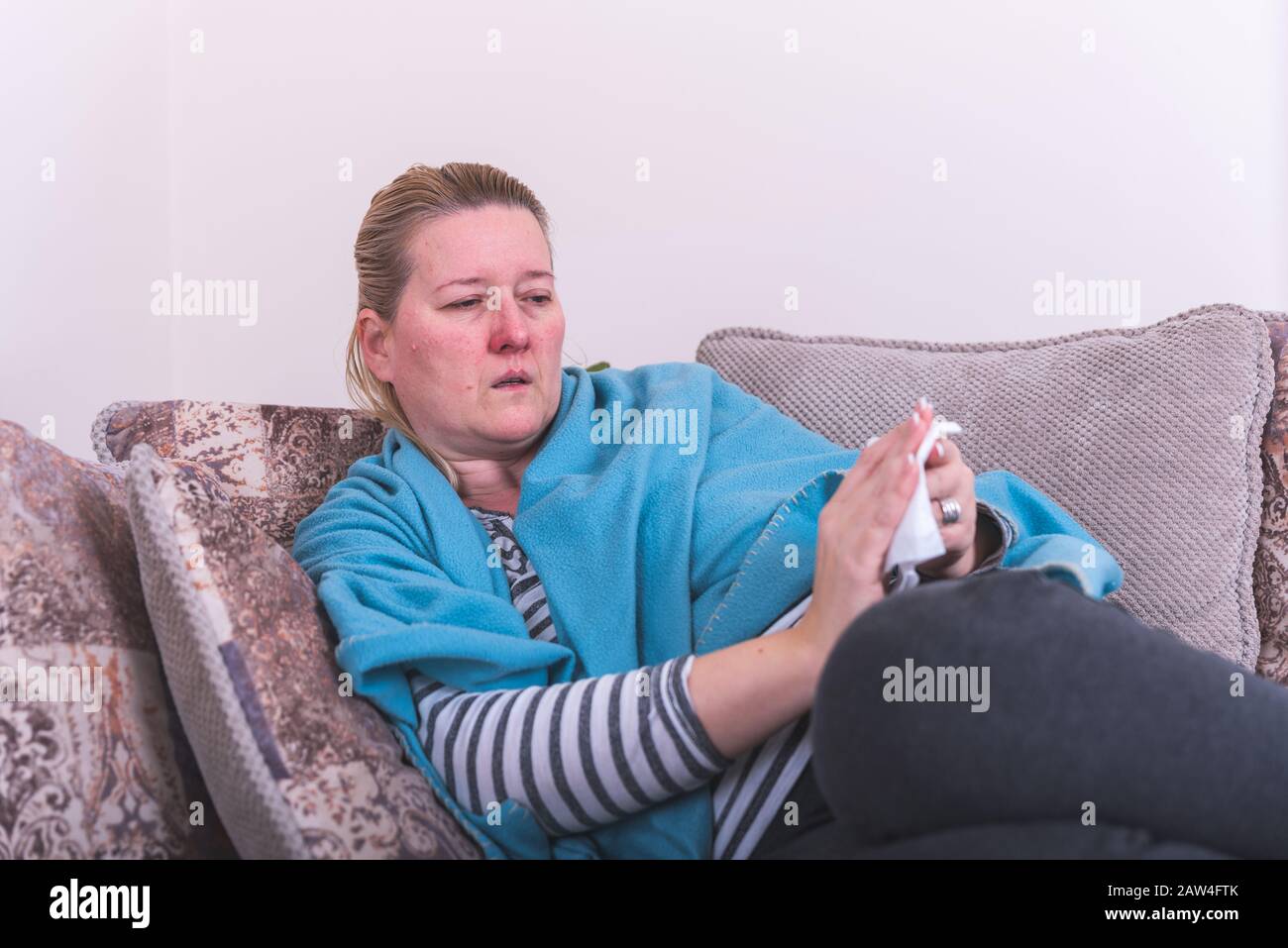 Very sick woman with the flu, fever and high temperature Stock Photo ...