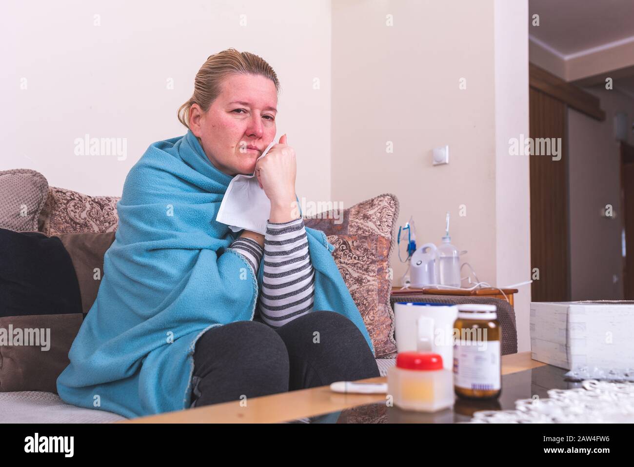 Very sick woman with the flu, fever and high temperature Stock Photo ...