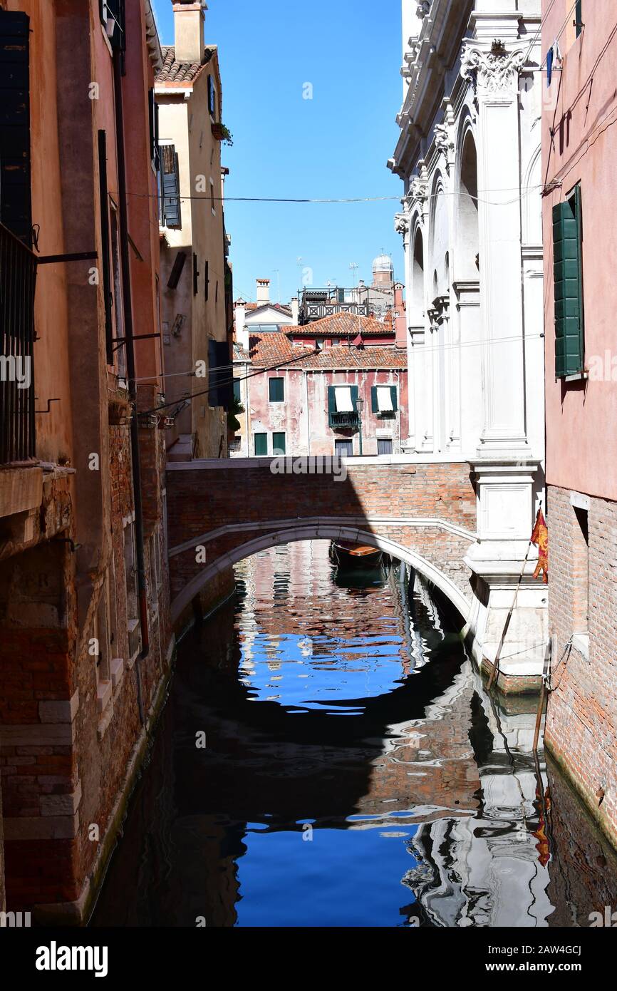 Small bridge over a canal in Venice, Italy, with its reflection Stock ...