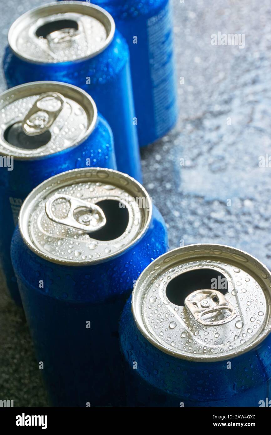 Blue soda cans recycling closeup. Soda cans with open pull tab and ...