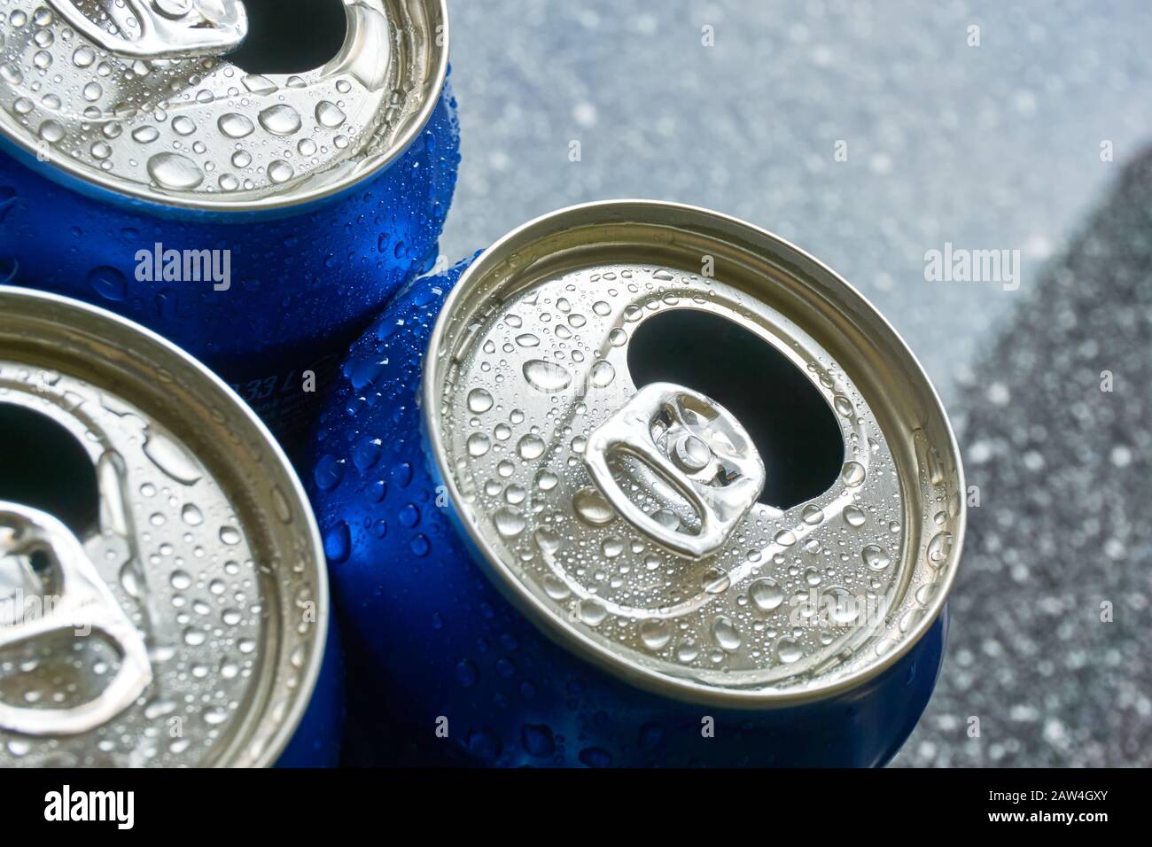 Blue soda cans recycling closeup. Soda cans with open pull tab and ...