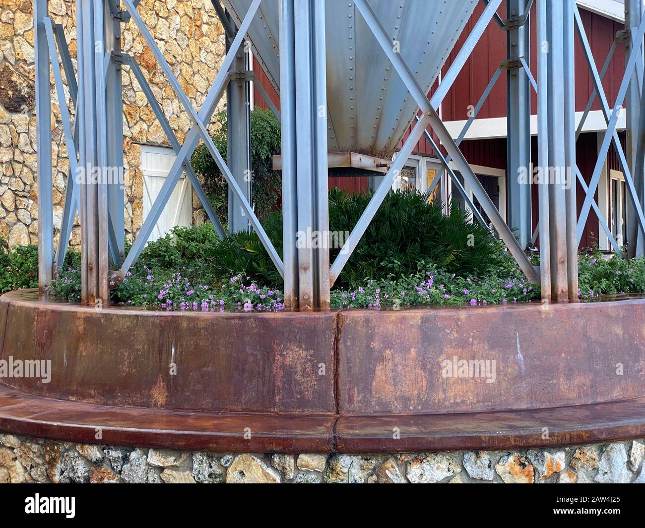 a rusted farm grain shoot turned into a bench Stock Photo - Alamy