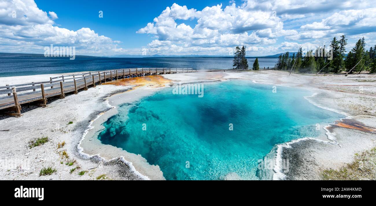 panorama of the blue water hot spring black pool in yellowstone ...