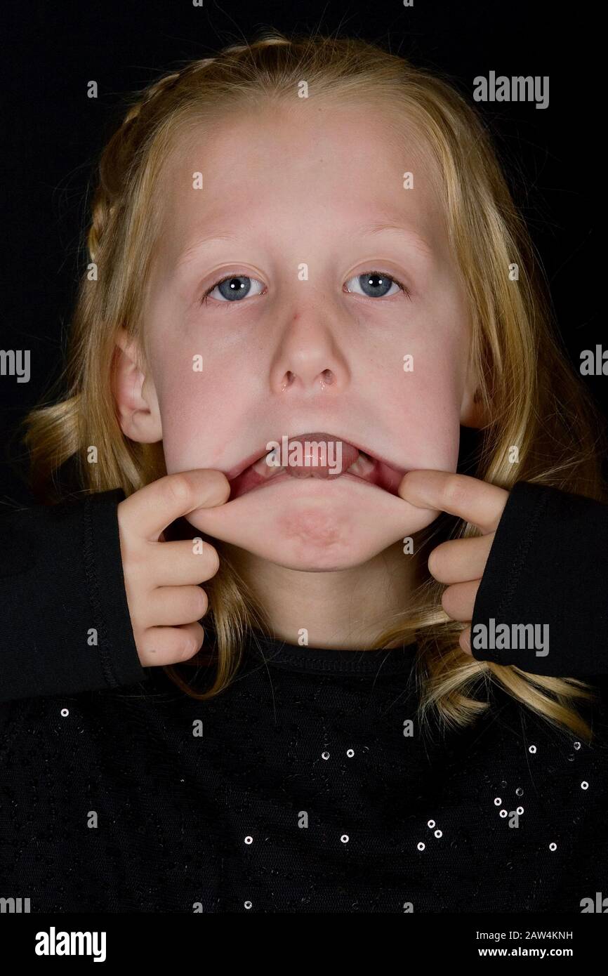 A young boy makes a silly face Stock Photo - Alamy