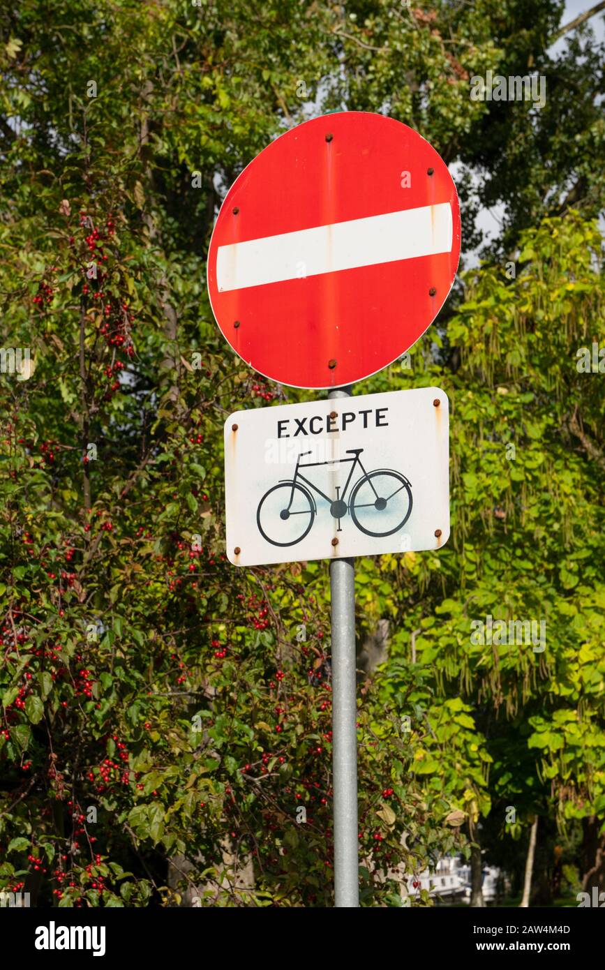Forbidden driving direction sign with an exception for bikes Stock ...