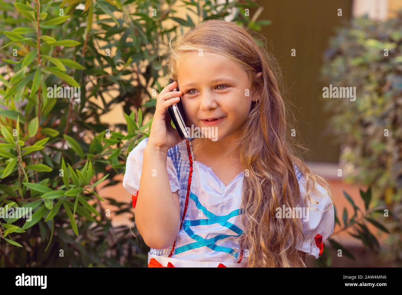 Phone talk happy. Little girl talking on the phone, excited and happy ...