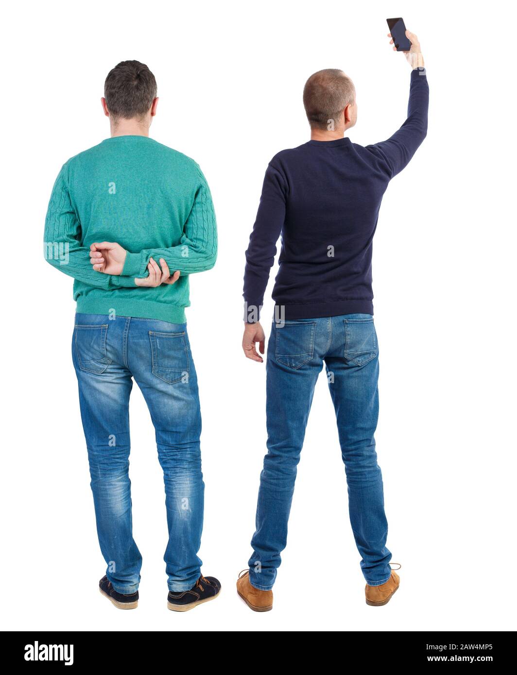 Back view of two man in sweater with mobile phone. Rear view people ...