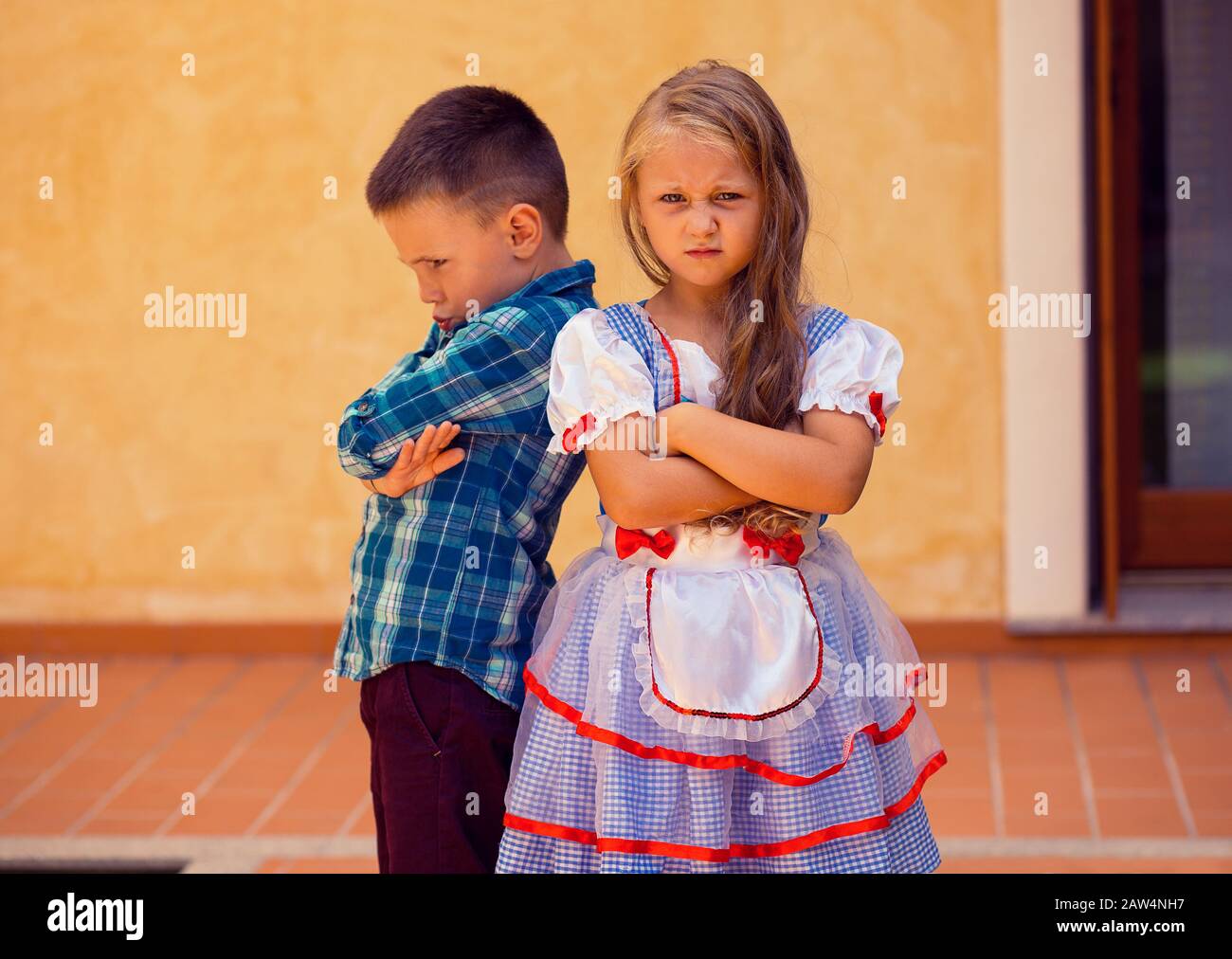 Two brothers are mad at each other, near the house Stock Photo - Alamy