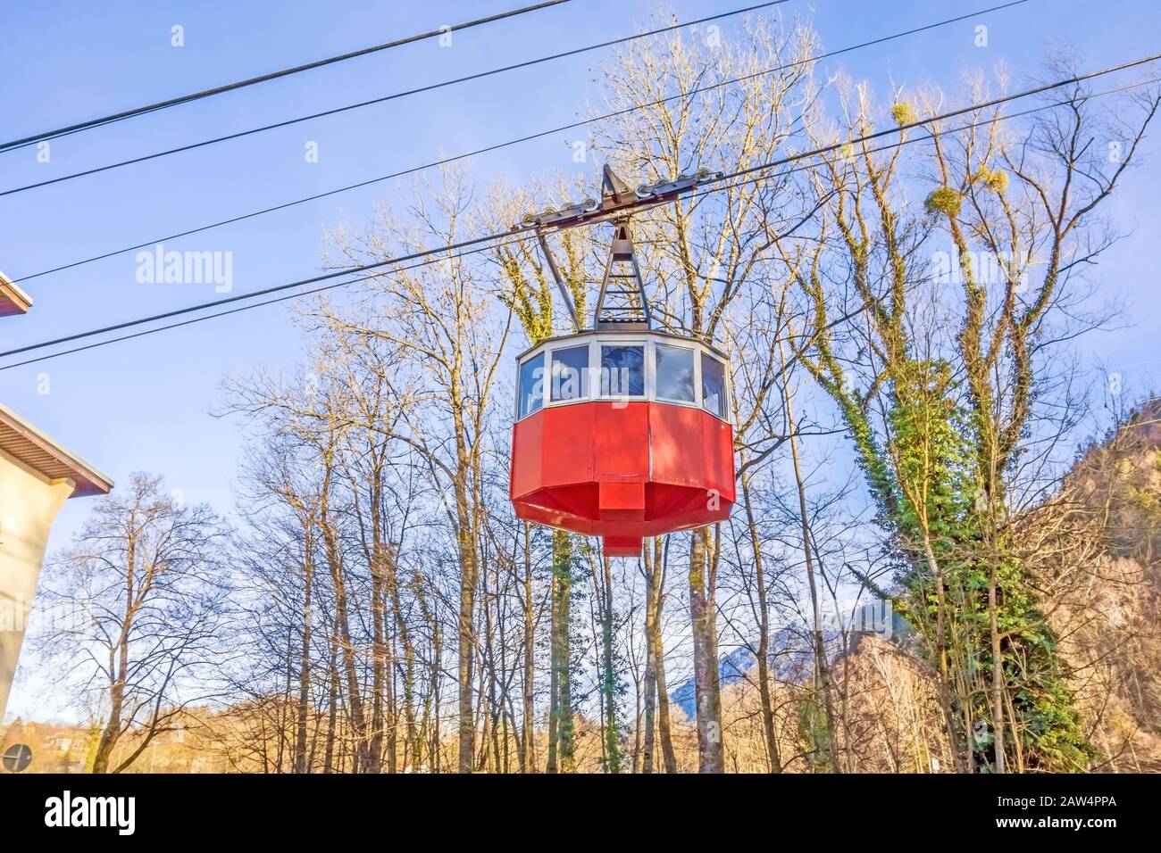 Ropeway gondola on its way to the mountain summit station Stock Photo ...