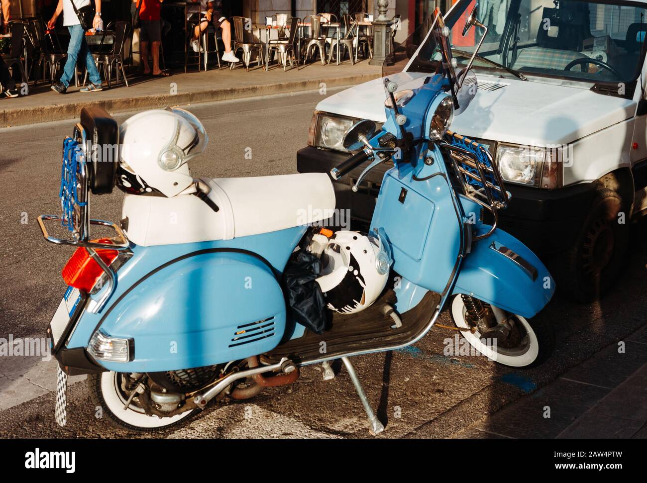 Light blue moped parked on the street in Italy Stock Photo - Alamy
