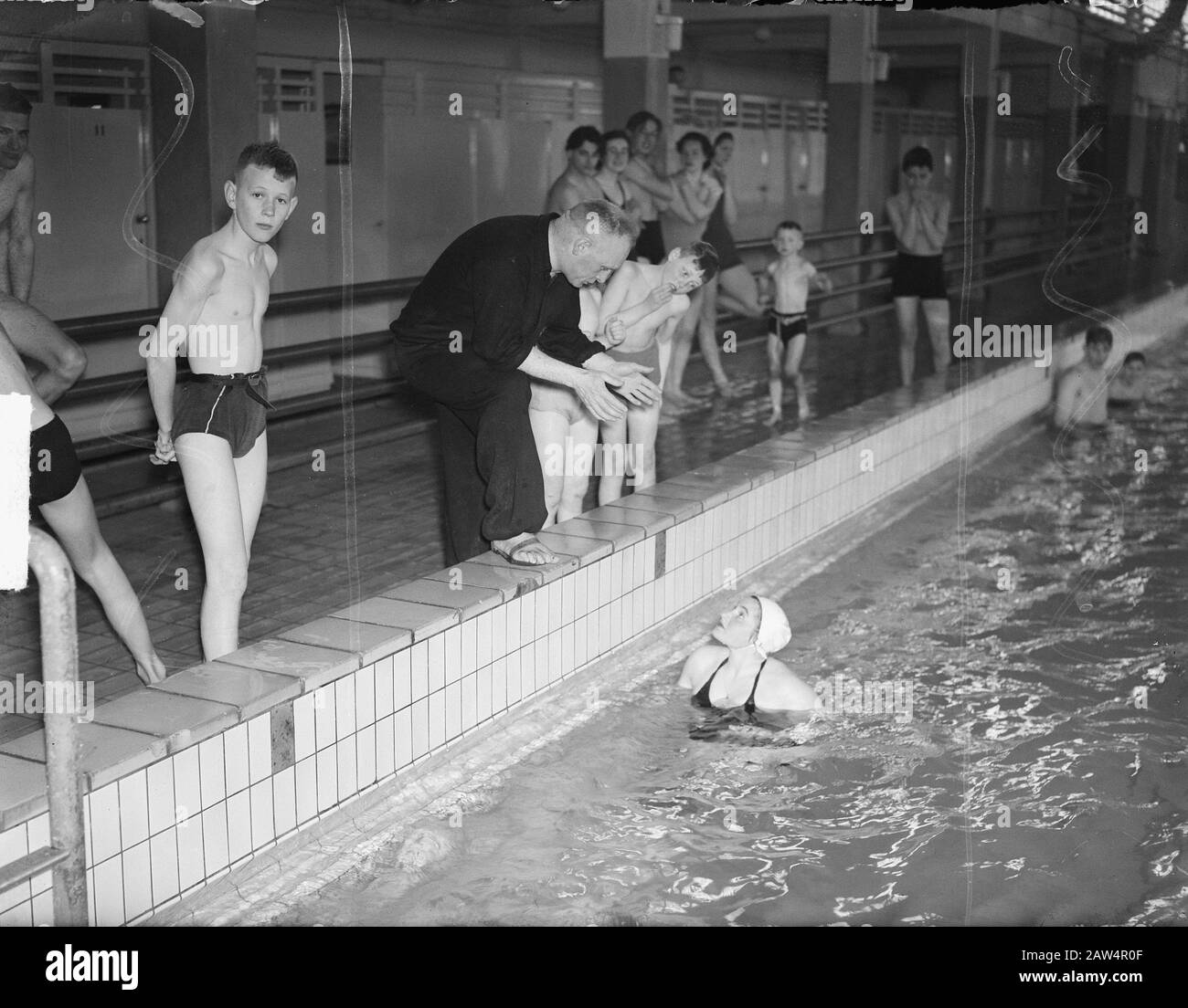 Nellie Theiler (Switzerland) 100 m, receives instructions from swim ...