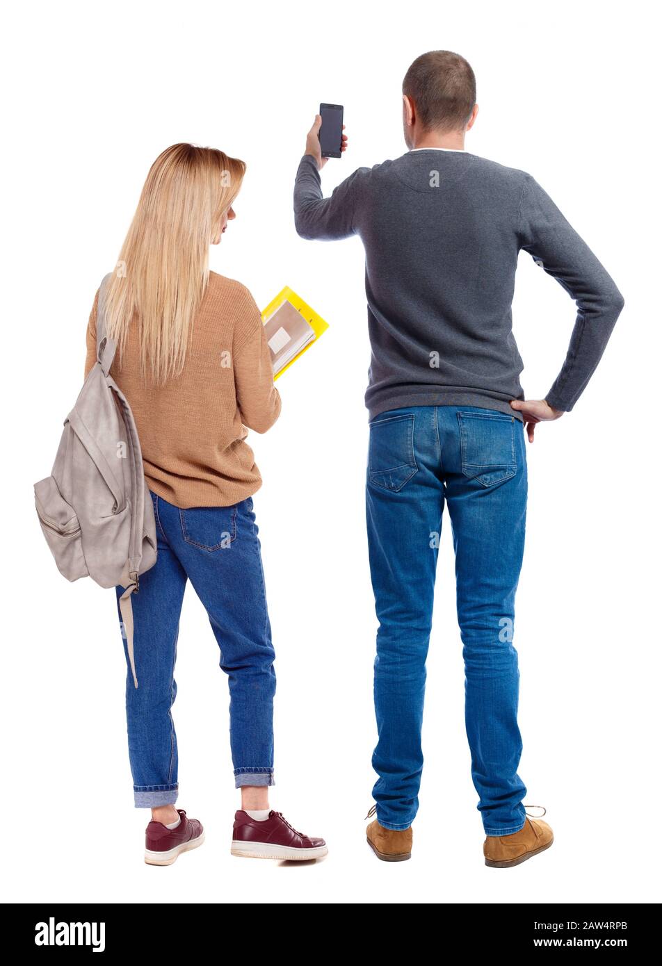 Back view of couple in sweater with mobile phone. beautiful friendly ...