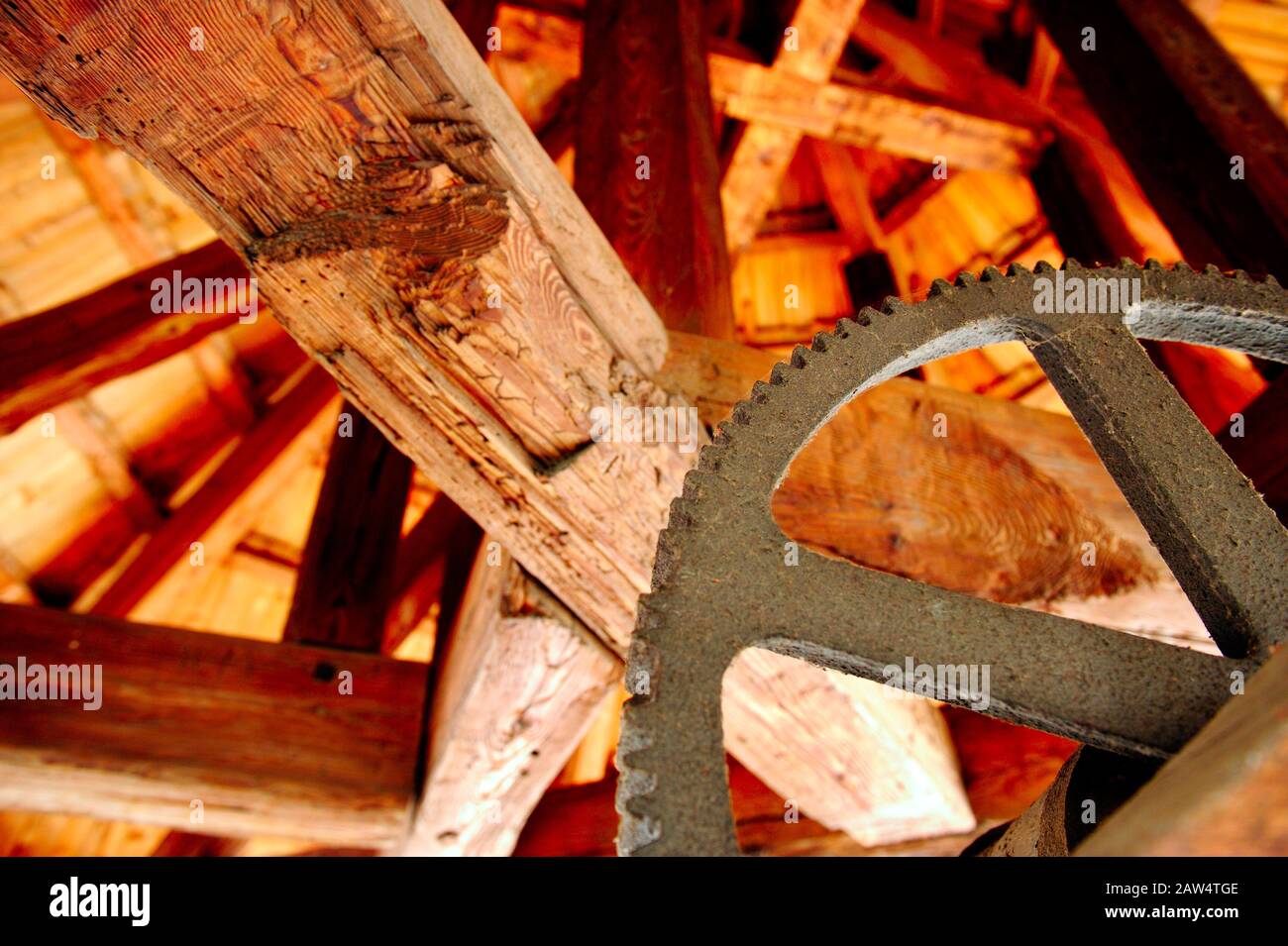 Impressive ancient, medieval roof woodwork with metal wheel beeing part ...