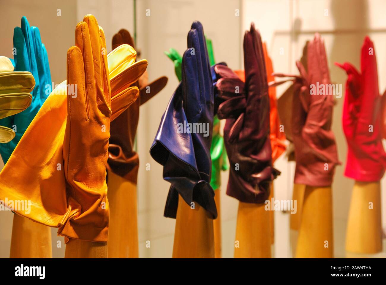 Colorful leather gloves collection displayed on wooden hands Stock ...