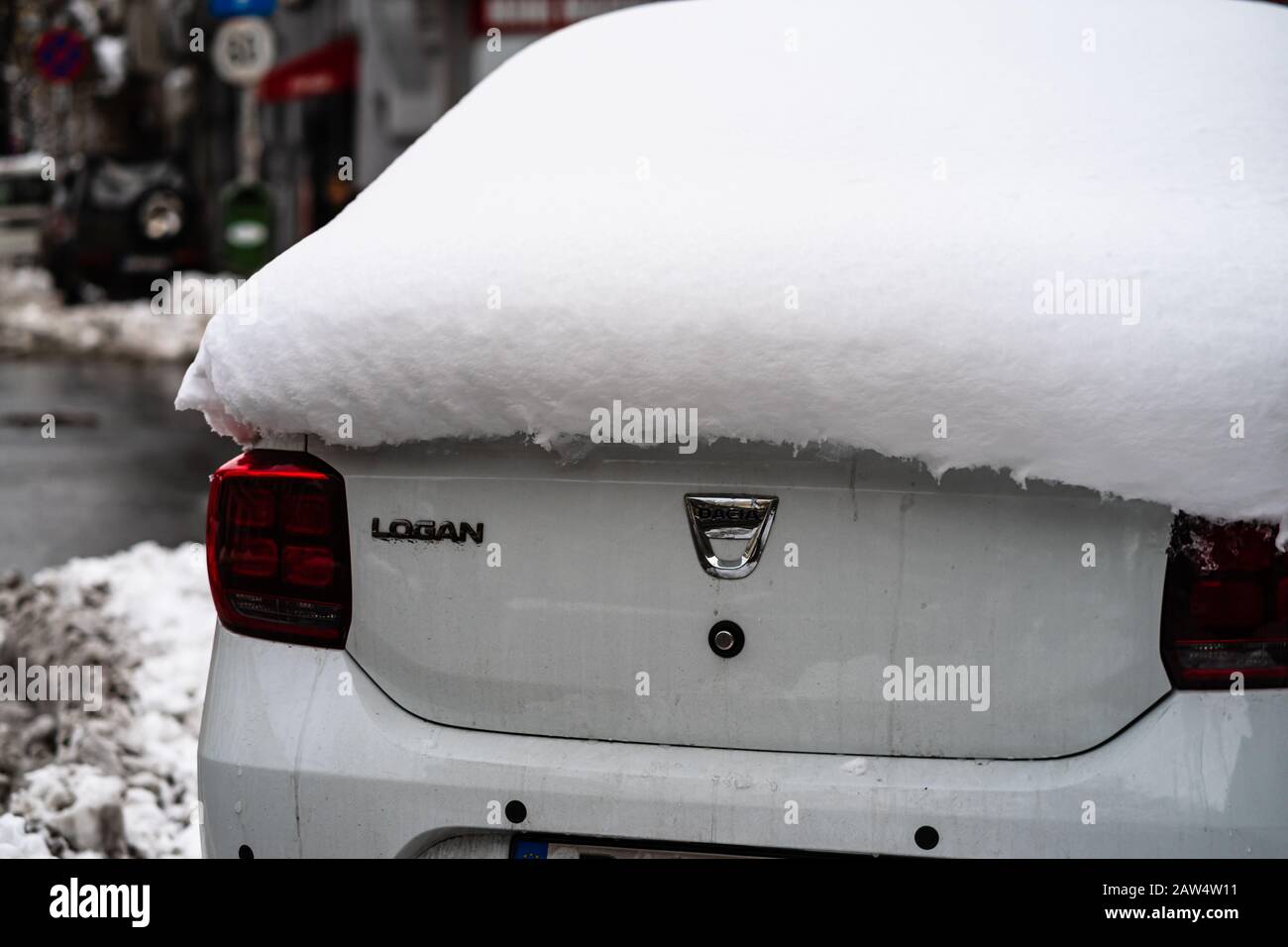 Snow on cars in the morning. Winter season and icy cars on the road in ...
