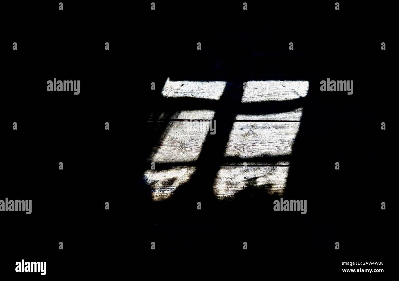Black background with light-filled windows Stock Photo - Alamy