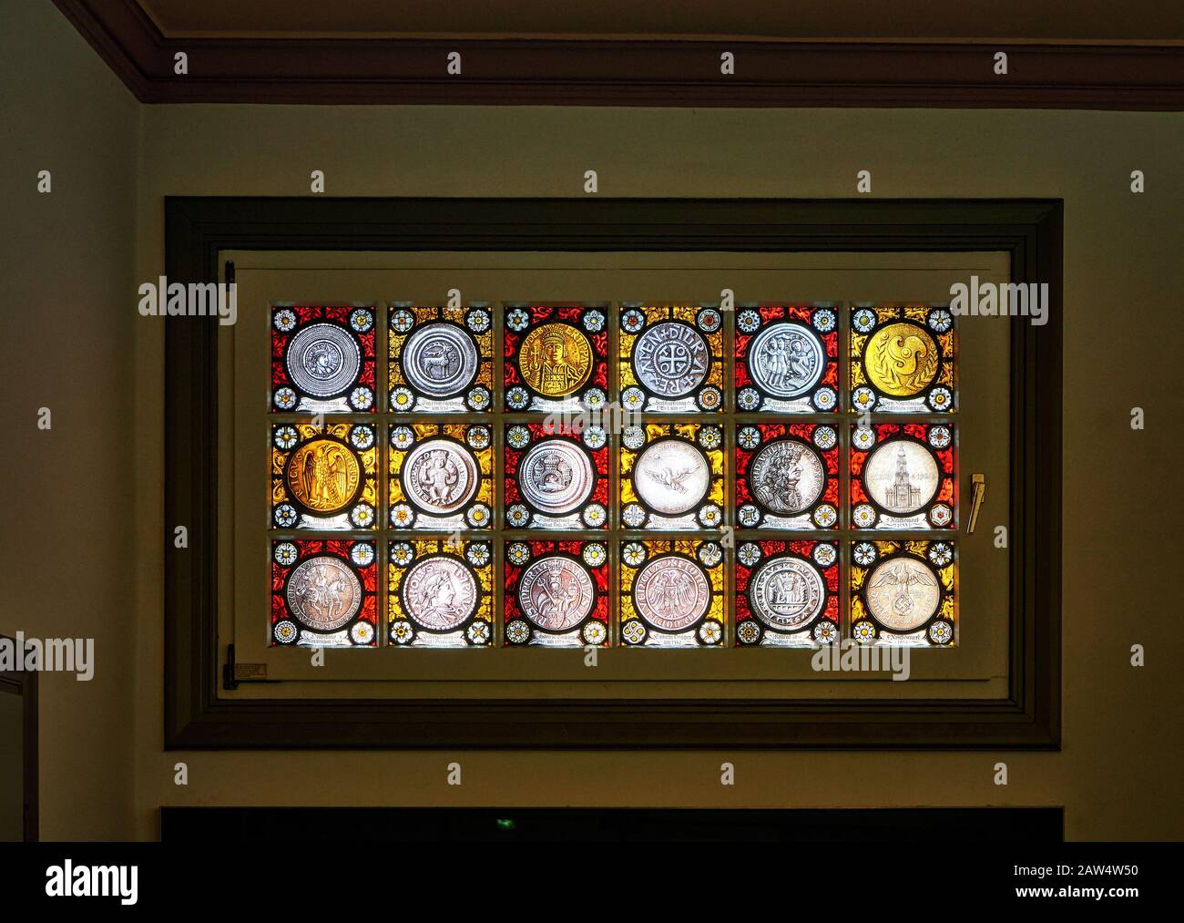 Historic German glass coins on a window Stock Photo - Alamy