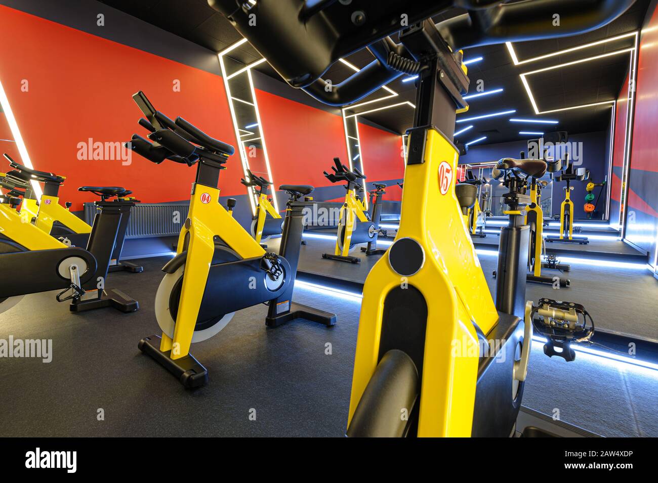 Aerobics spinning indoor bikes class Stock Photo - Alamy