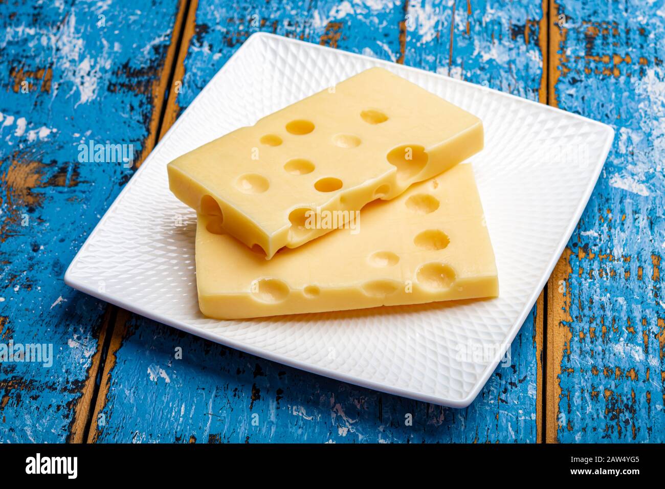Two blocks of French emmental semi-hard cheese close up Stock Photo - Alamy