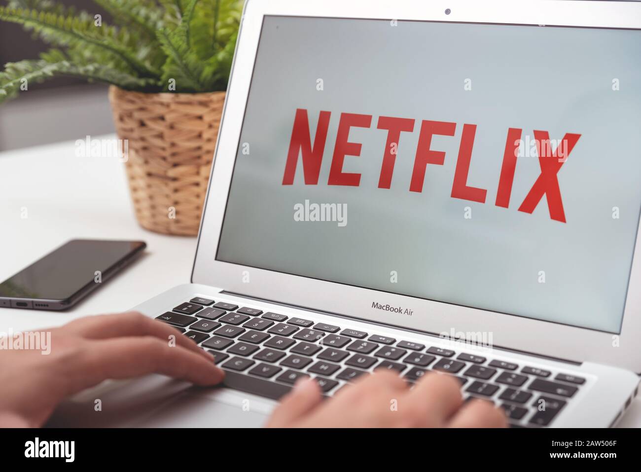 Wroclaw, Poland - OCT 23, 2019: Man with Netflix logo on screen ...