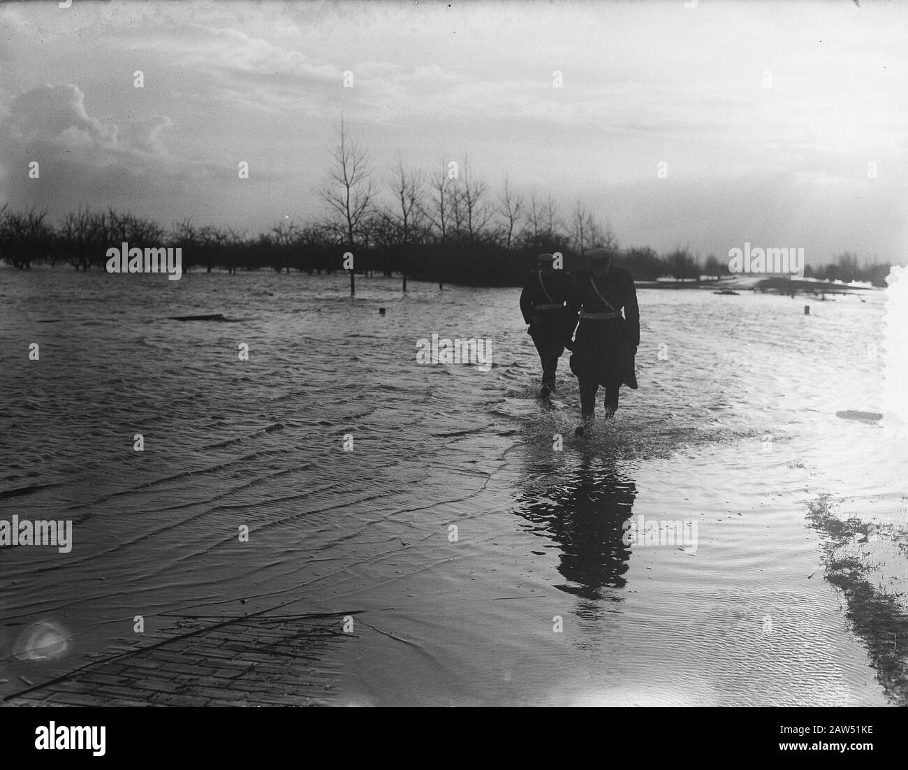 Flooding villages such exclusives. Police check flooded road Date ...
