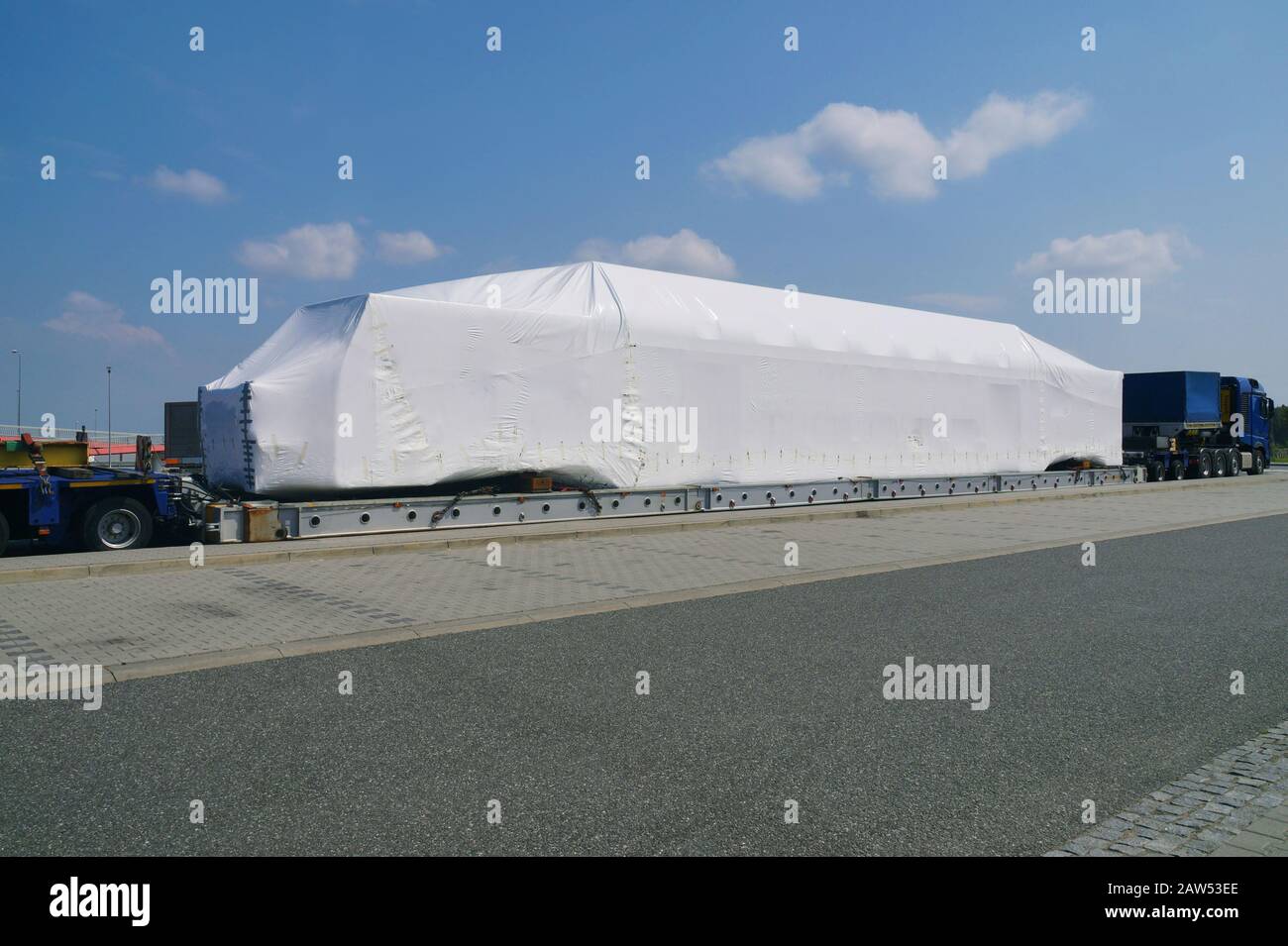 A truck with a special semi-trailer for transporting oversized loads ...