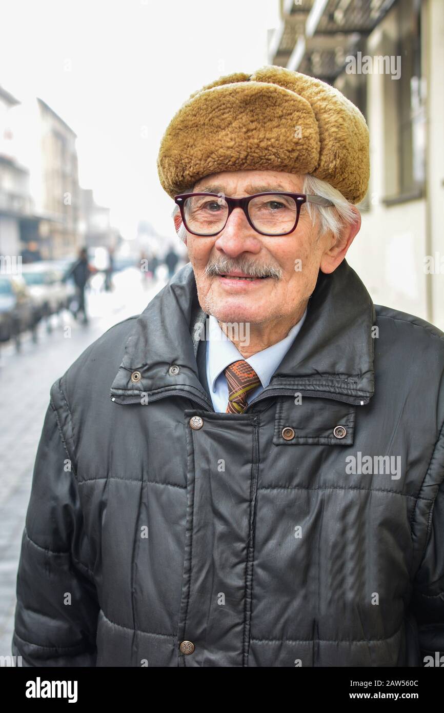 Portrait of very vital, active old man posing in the street Stock Photo ...