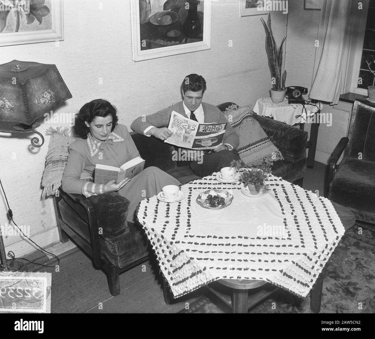 Luc Van Dam home [reading with wife] Annotation: Luc van Dam was during ...