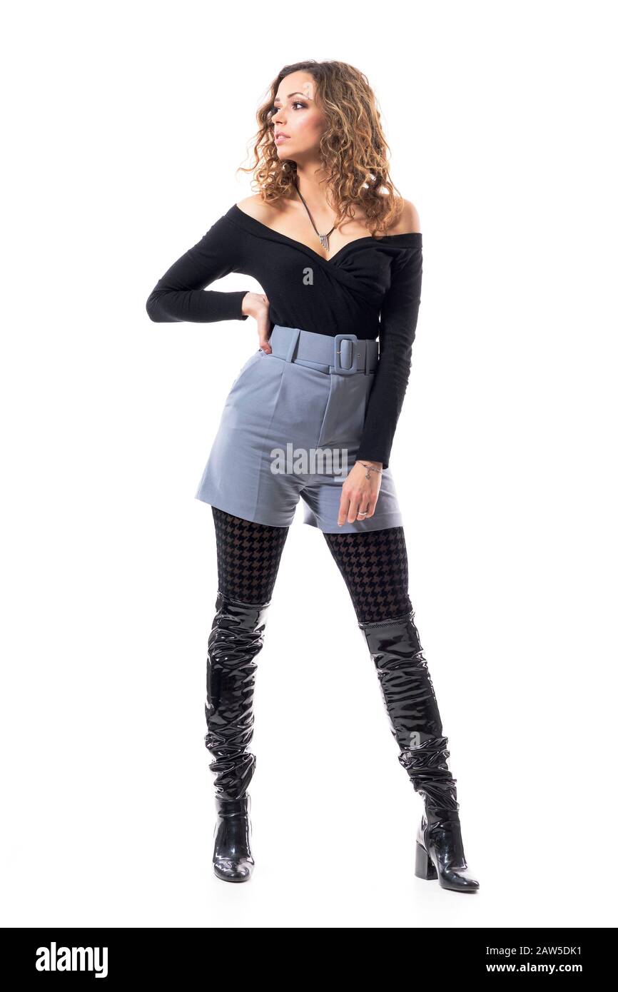 Confident young curly hair woman fashion model in elegant clothes with ...